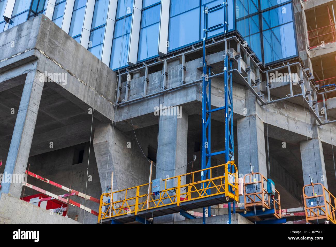 construction of a skyscraper fasade construction lift concrete and ...