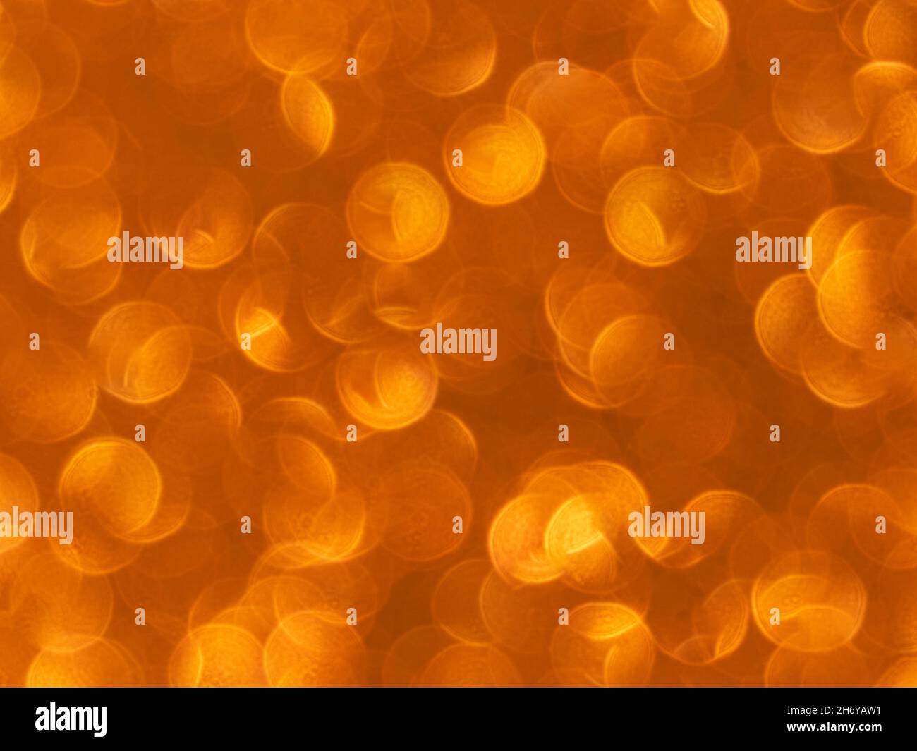 Texture made of oval yellow objects. The effect was obtained by ...