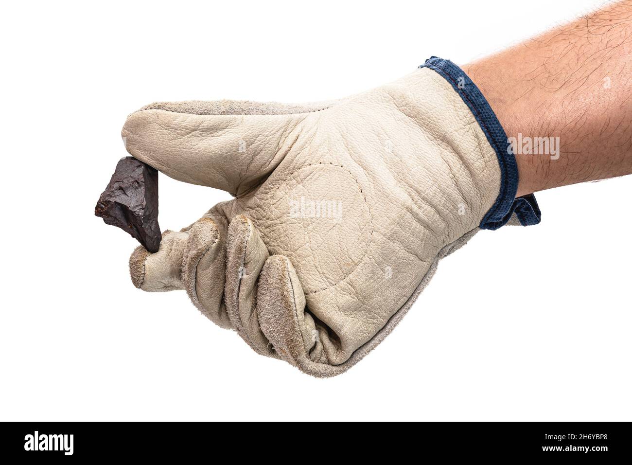 miner hand with protective glove holding metallic rock, isolated white ...