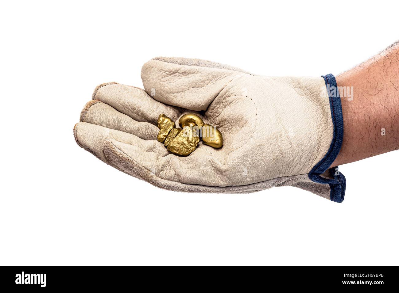 miner hand with protective glove holding gold ore, golden metallic ...
