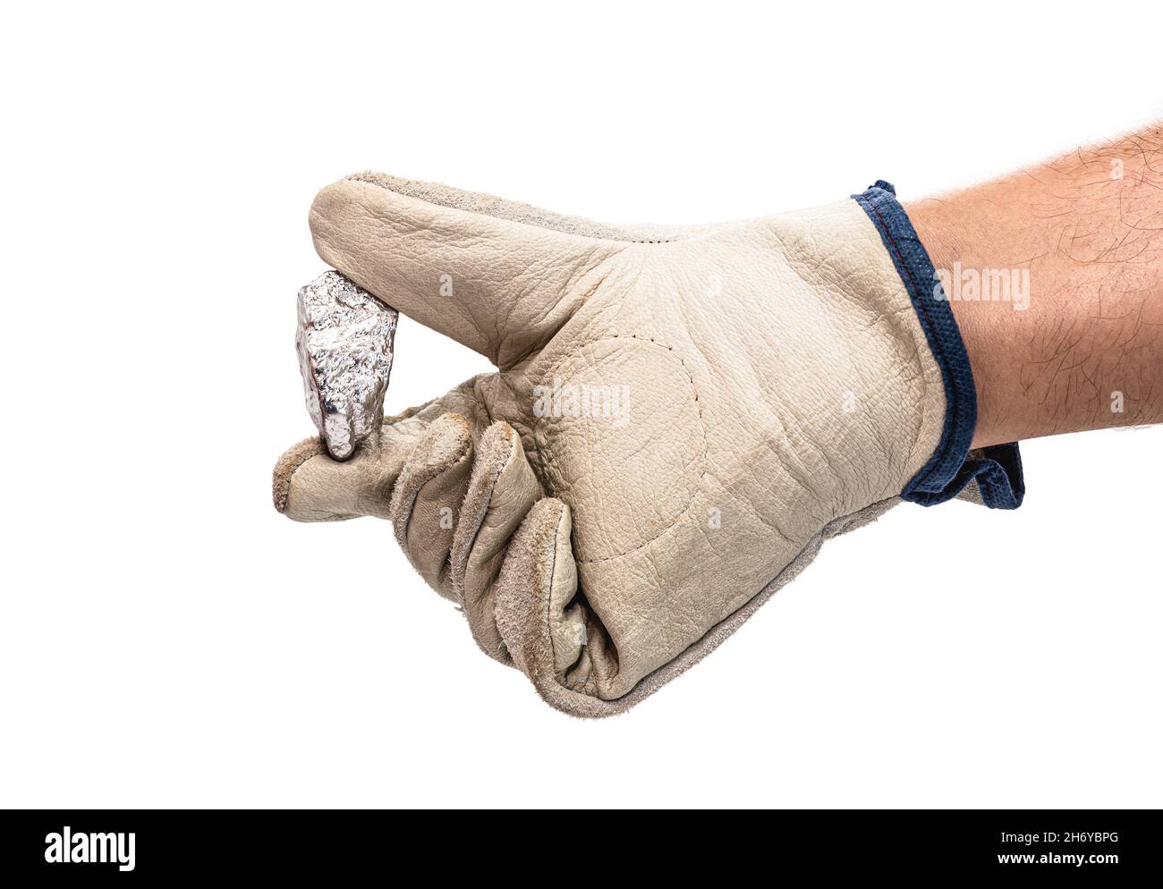 miner hand with protective glove holding silver color ore, metallic ...