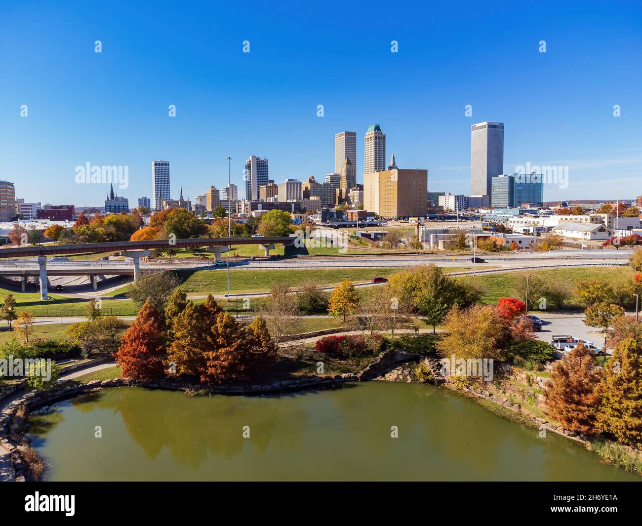 Aerial view of the downtown cityscape and fall color of Veterans Park ...