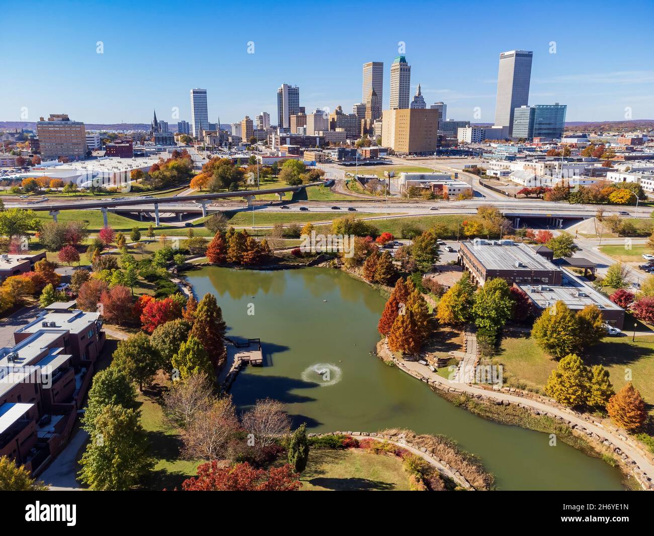Aerial view of the downtown cityscape and fall color of Veterans Park ...