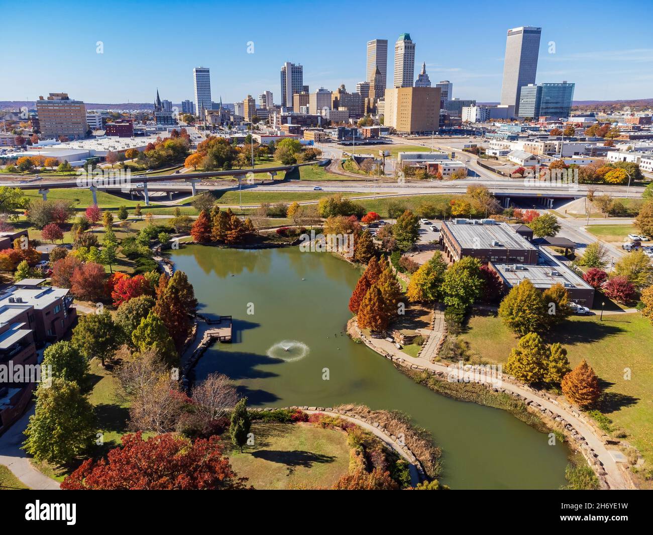 Aerial view of the downtown cityscape and fall color of Veterans Park ...