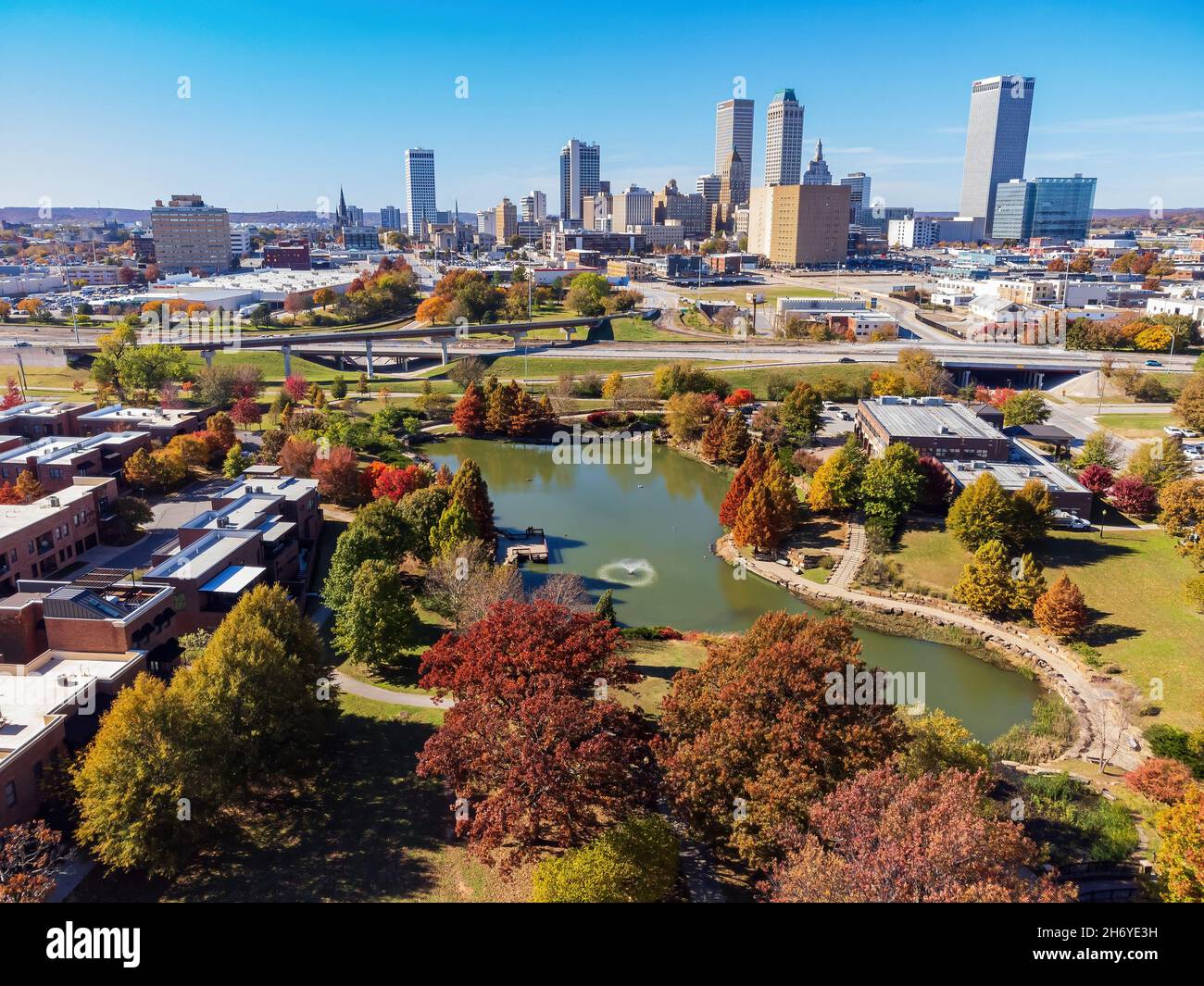 Aerial view of the downtown cityscape and fall color of Veterans Park ...