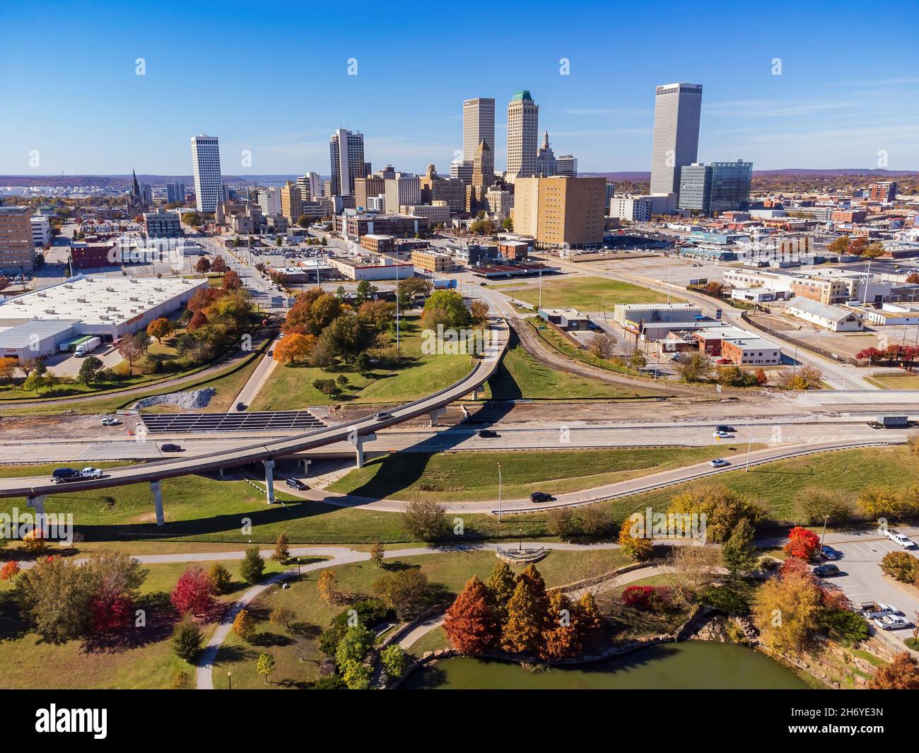 Aerial view of the downtown cityscape and fall color of Veterans Park ...