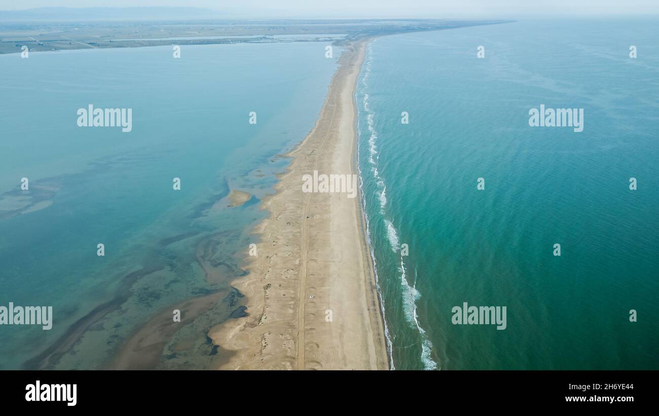 Scenic view of a sandy path between two oceans Stock Photo - Alamy