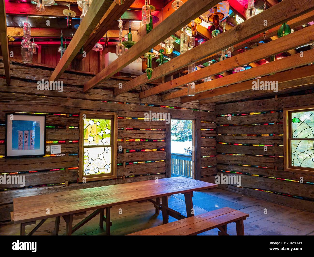 Tulsa, NOV 12 2021 - Many colorful bottle hanging in a wooden house of ...
