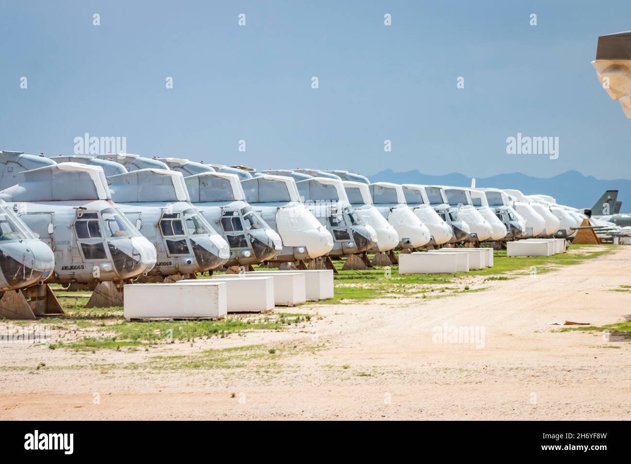 rows of decommissioned and wrapped helicopters at Davis-Monthan Air ...