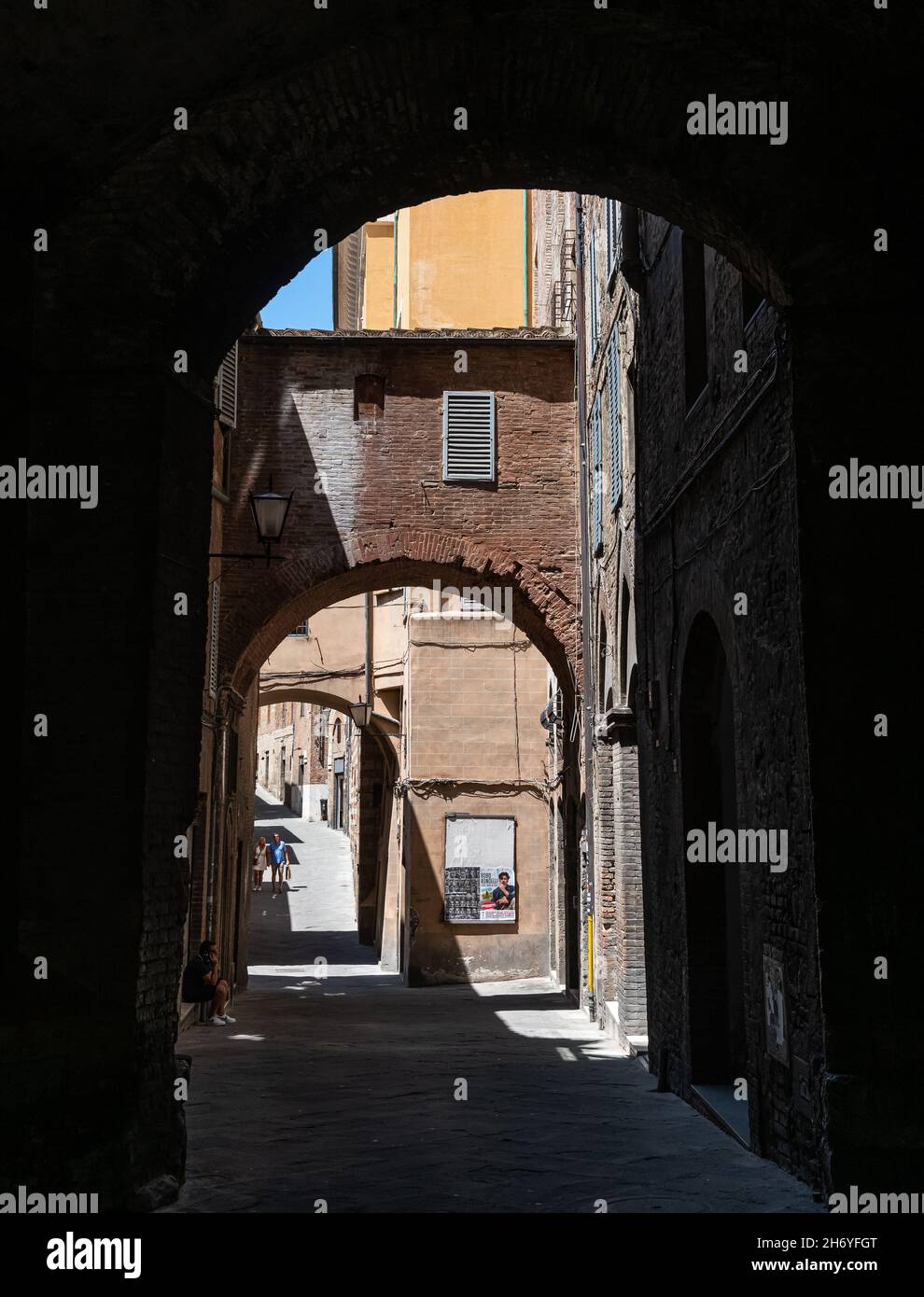Narrow Street in Historic Center of Siena, Tuscany, Italy. Old brick ...