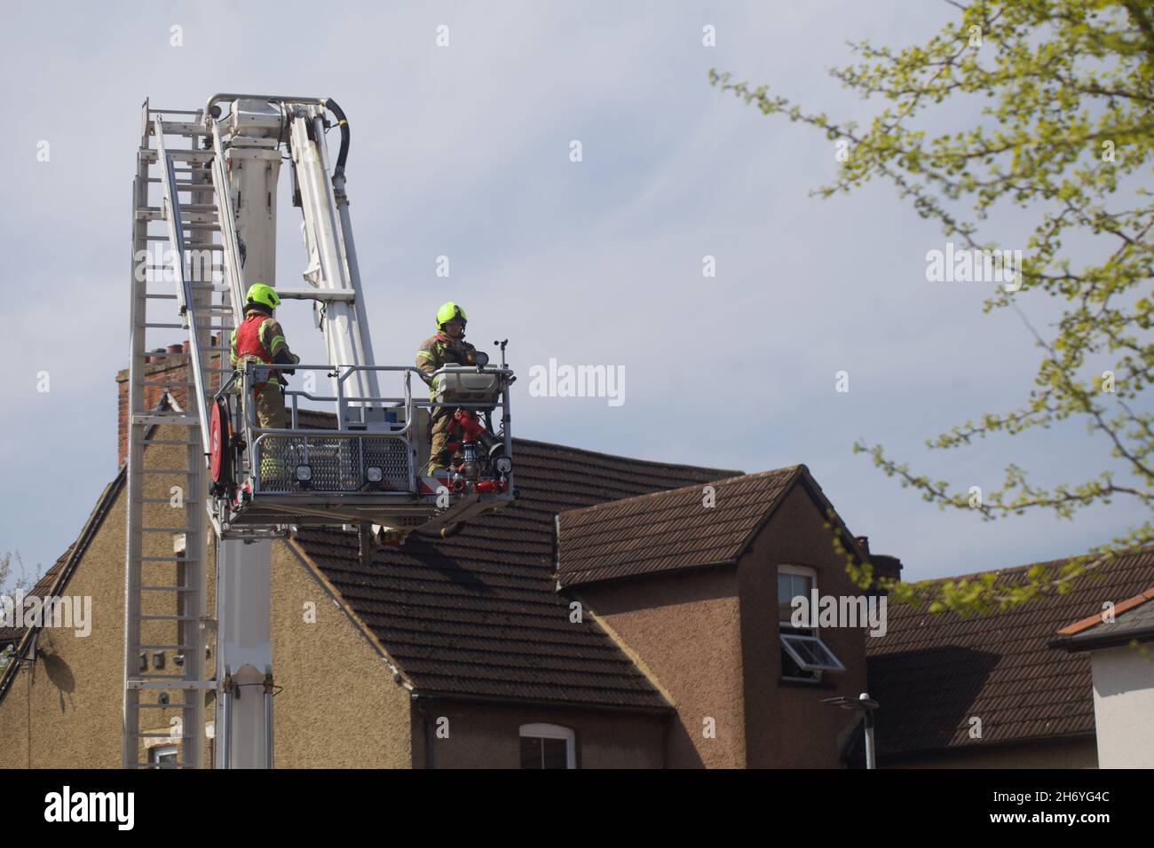 Firefighters on ladder Stock Photo - Alamy