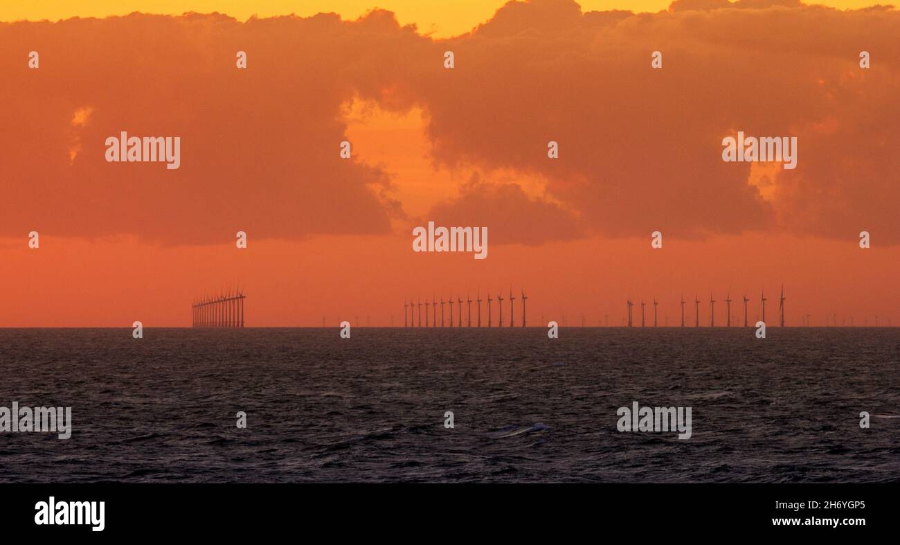 Off shore wind farm at sunset. Wind turbines Stock Photo - Alamy