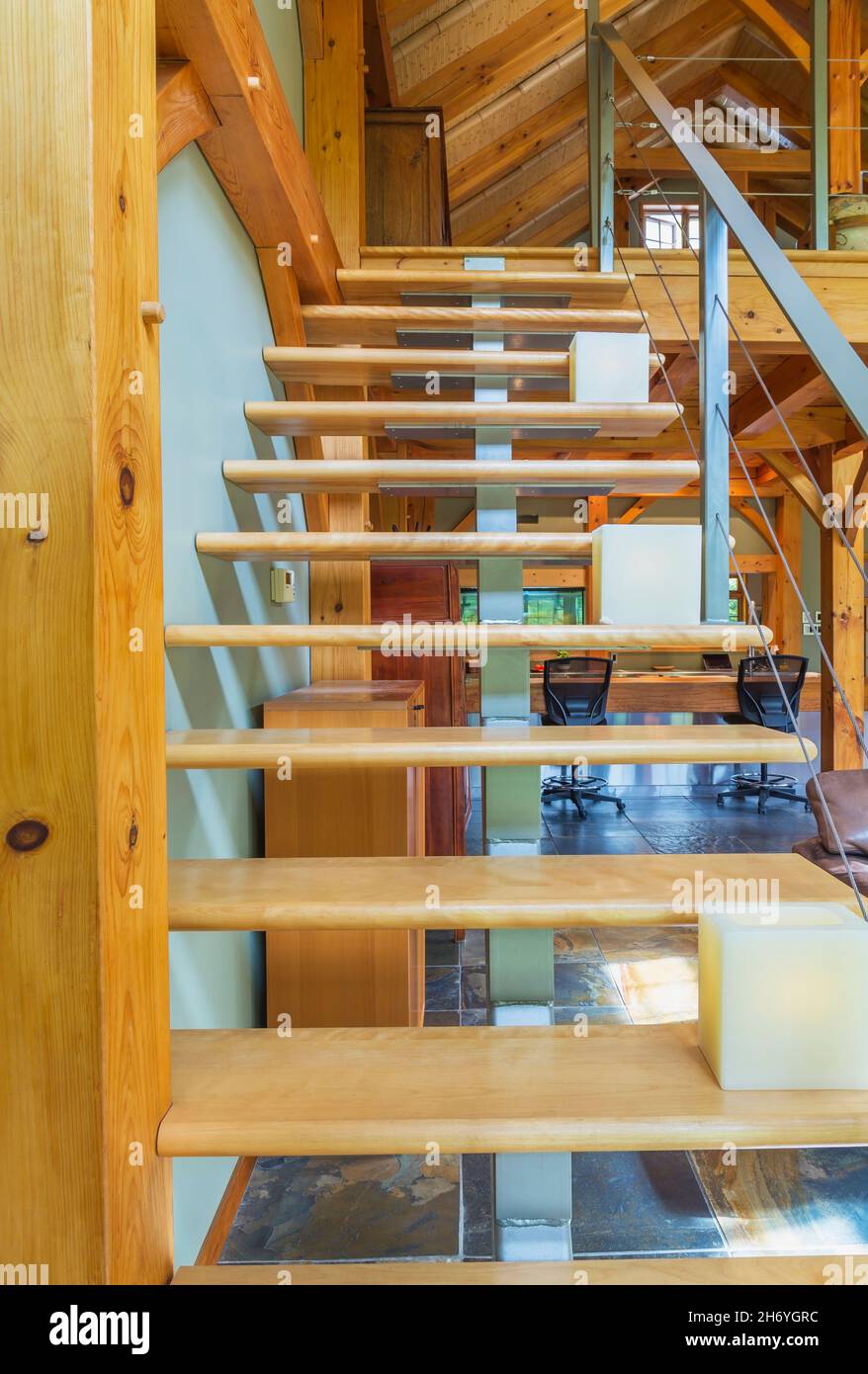 Staircase with steel centre spine, pine wood steps leading to upstairs ...