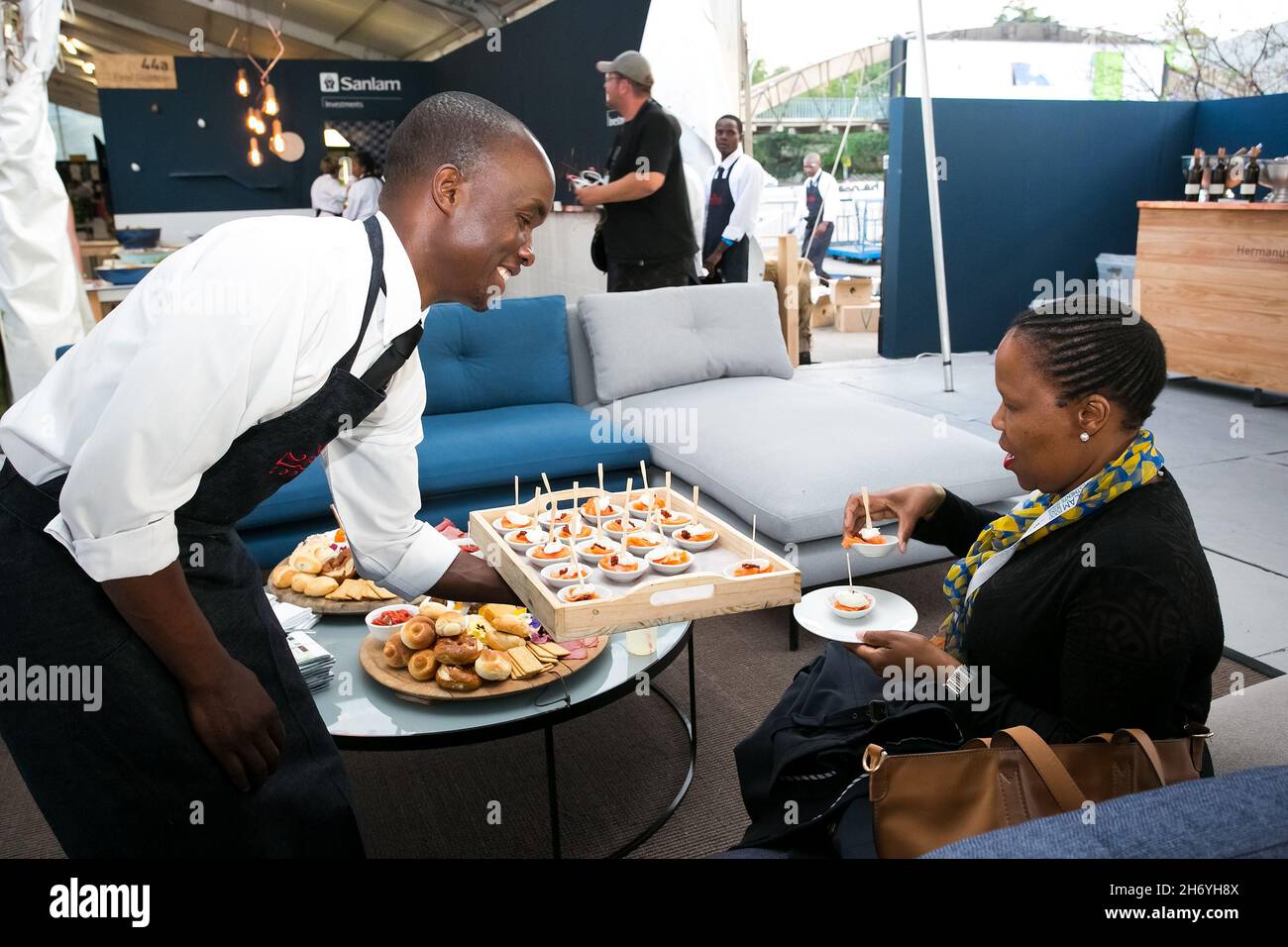 JOHANNESBURG, SOUTH AFRICA - Oct 19, 2021: A view of Waiters with food ...