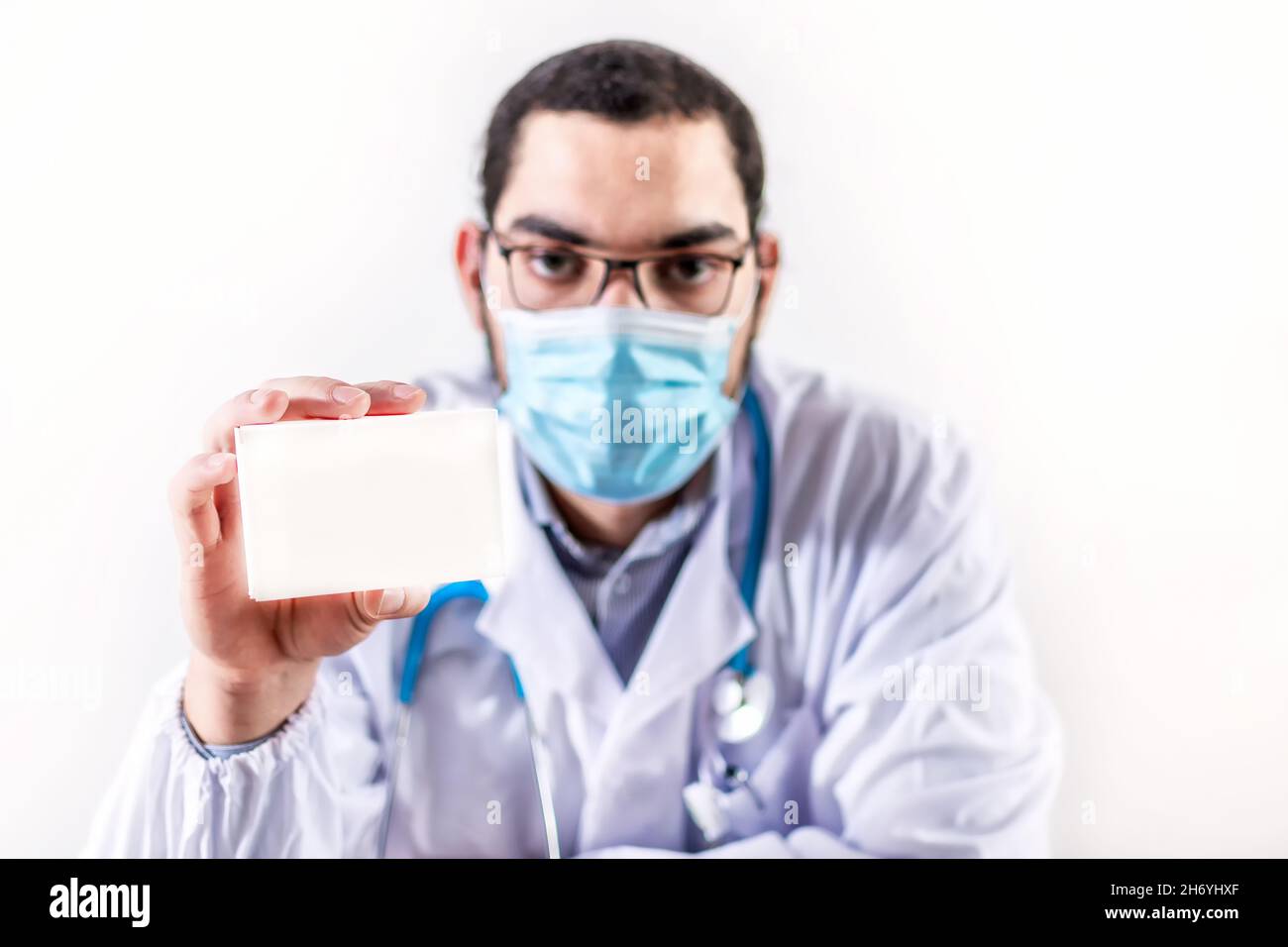 White Caucasian medical doctor showing a medicine Stock Photo - Alamy