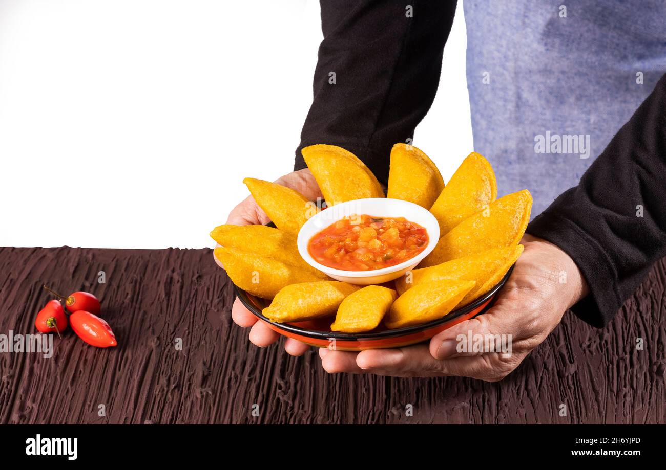 Fried empanadas with spicy sauce - typical Colombian food Stock Photo ...