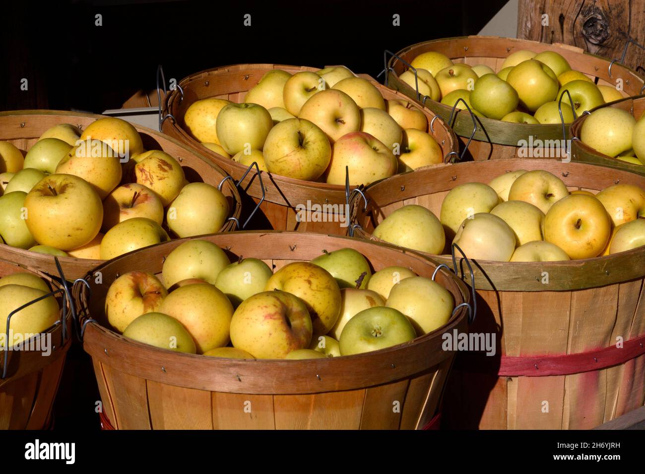 Baskets of apples for sale at a roadside produce stand in rural Velarde ...