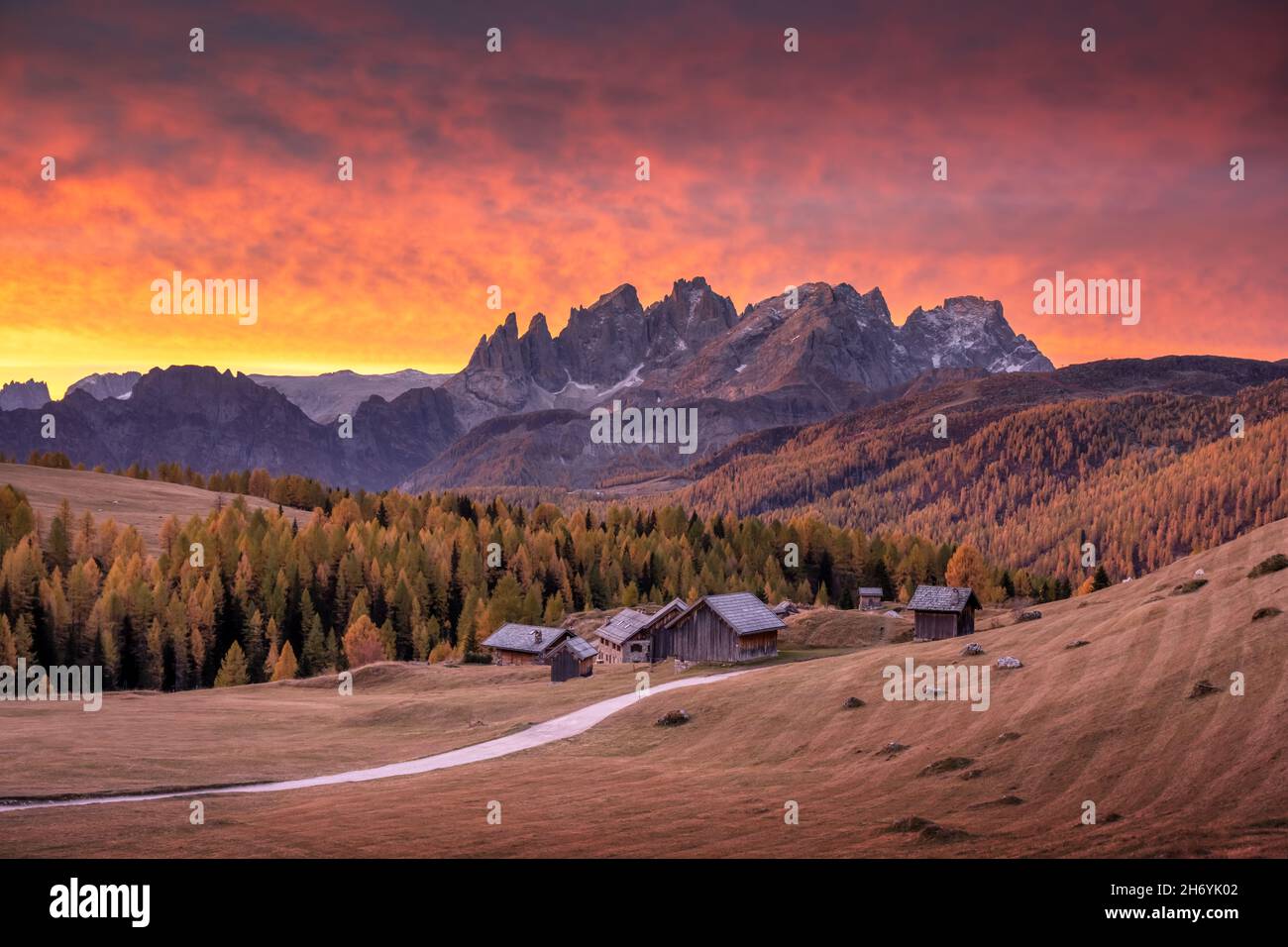 Incredible red sunset at Fuchiade valley in Italian Dolomites ...