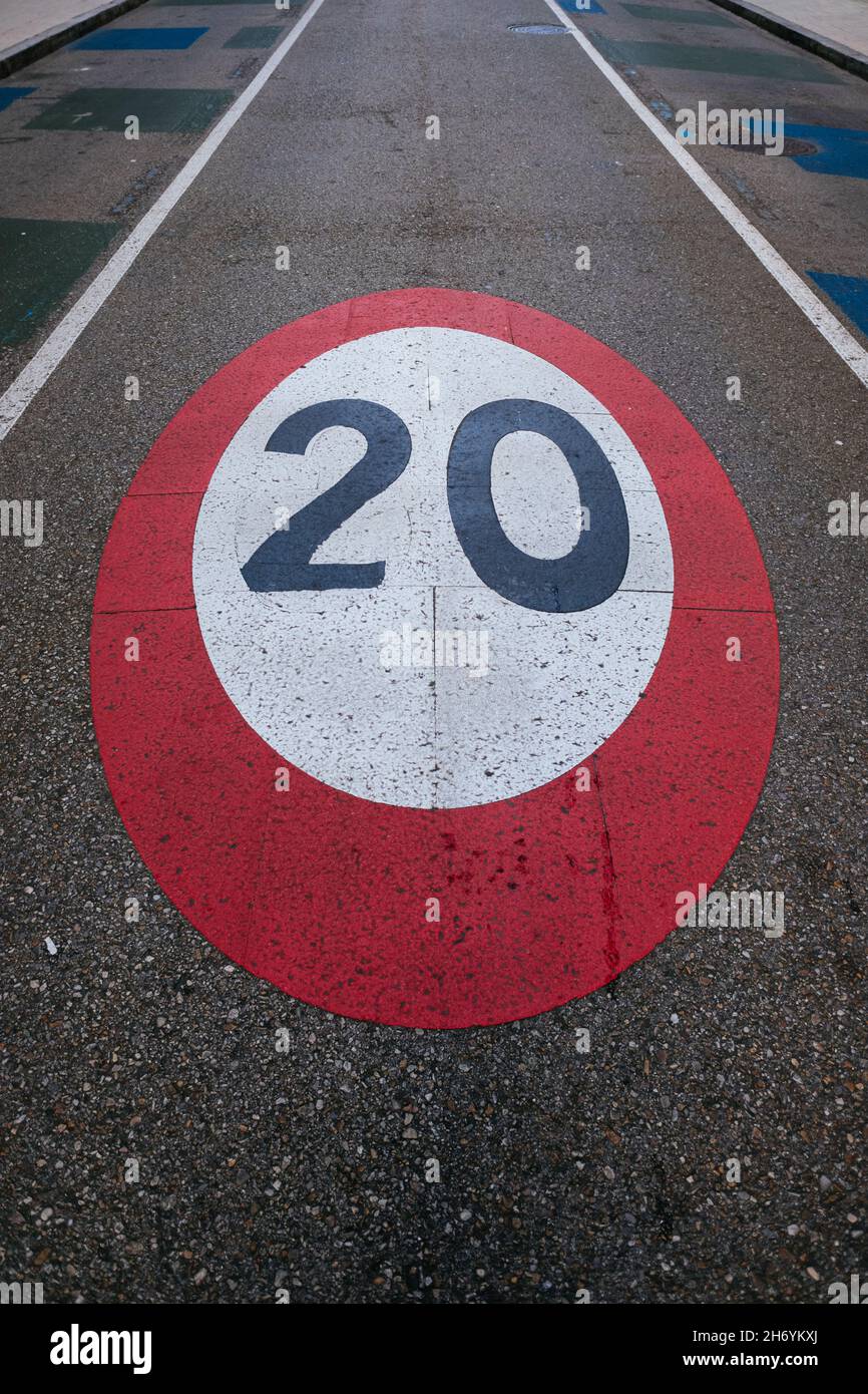 Vertical shot of speed limit sign of twenty painted on the road Stock ...