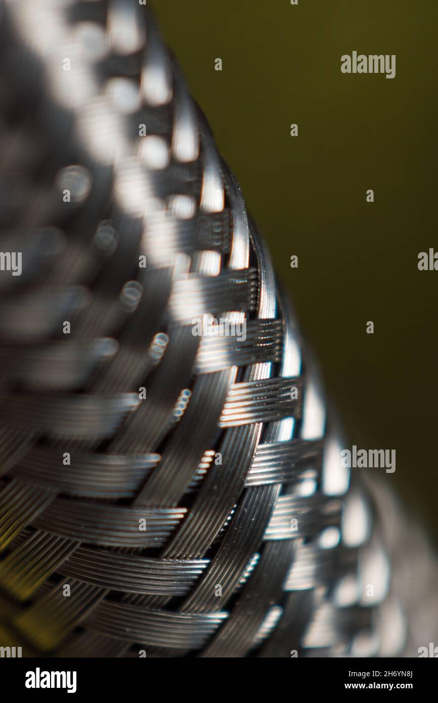 Macro of metal cable texture with a golden background Stock Photo - Alamy