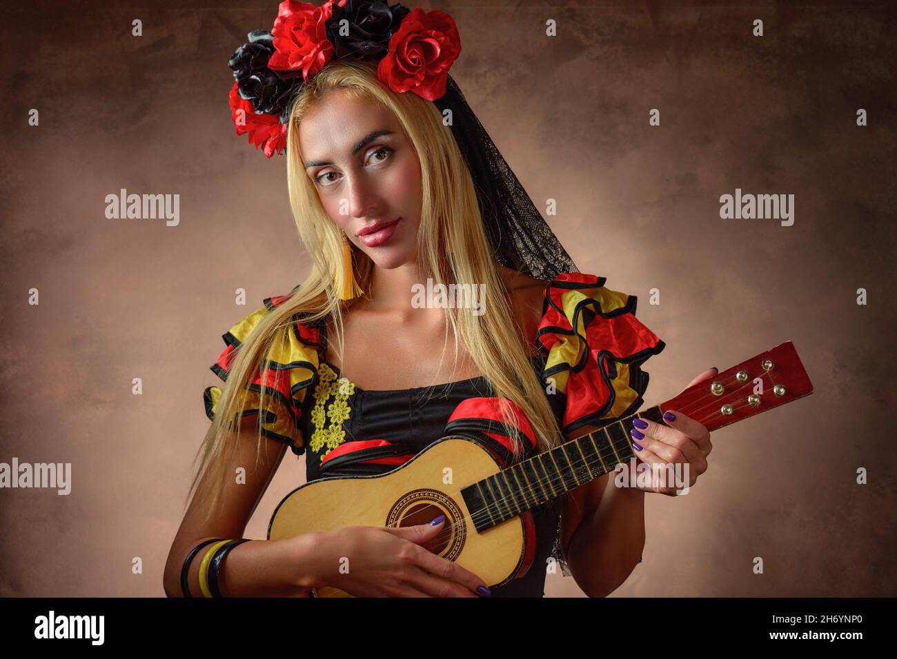 Gypsy woman wearing a traditional dress and playing charango Stock ...