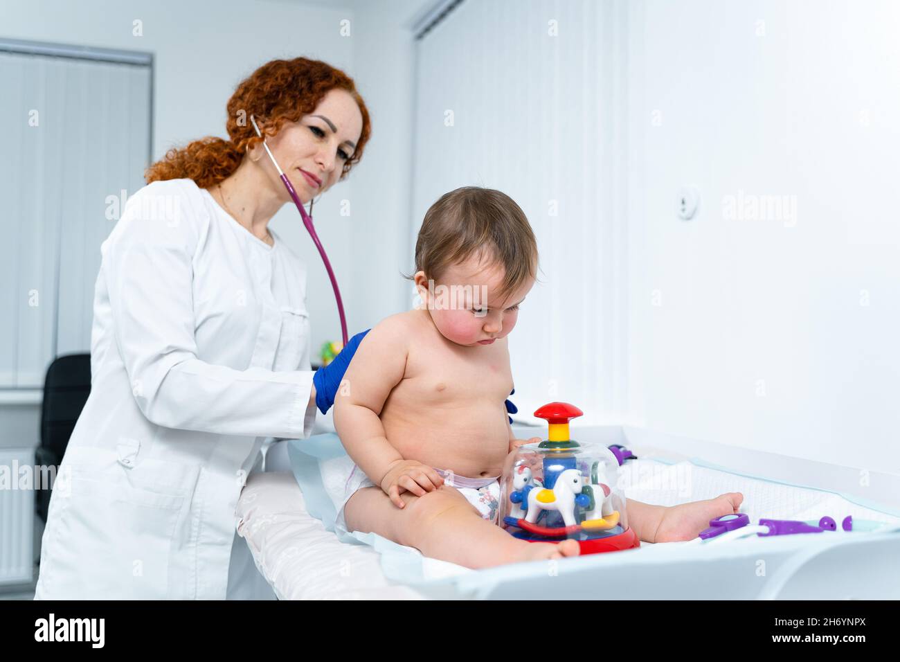 Pediatrician doctor concept. Children medical care. One year old baby ...