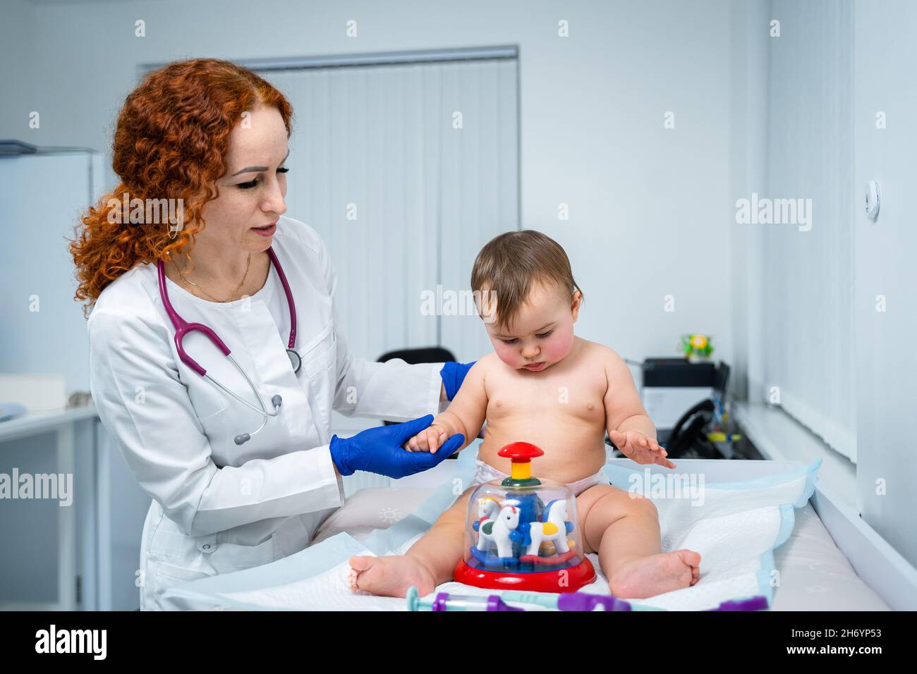 Pediatrician doctor concept. Children medical care. One year old baby ...