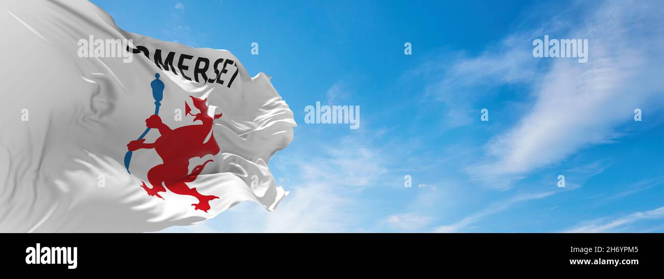 flag of county Somerset Unofficial, UK at cloudy sky background on ...