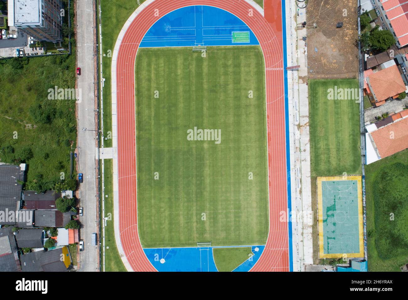Aerial view of empty new soccer field from above with running tracks ...