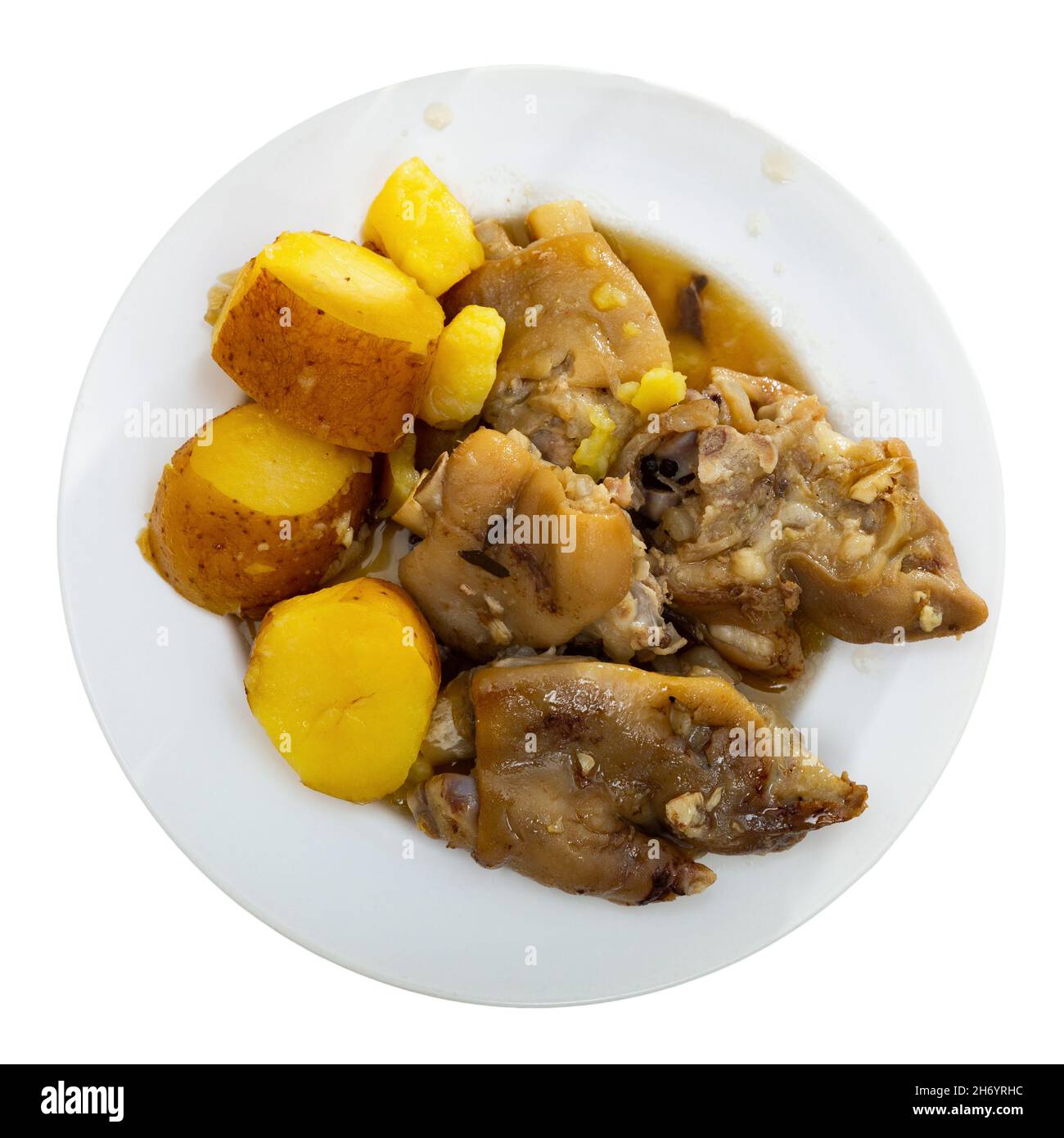 Stewed pig trotters with potato, homemade dinner Stock Photo - Alamy