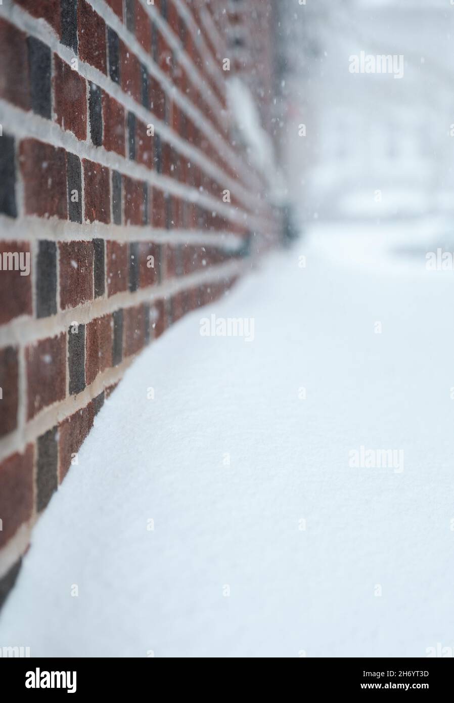 Vertical shot of a red brick wall and a pure snow Stock Photo - Alamy