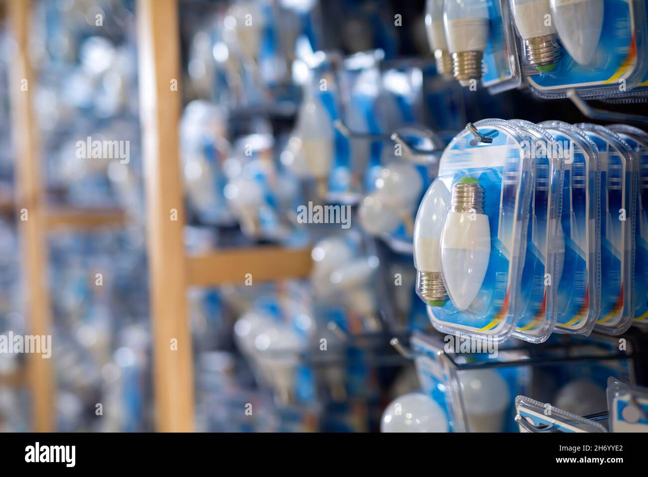 Energy saving lamps on shelves of an electrical goods store Stock Photo ...