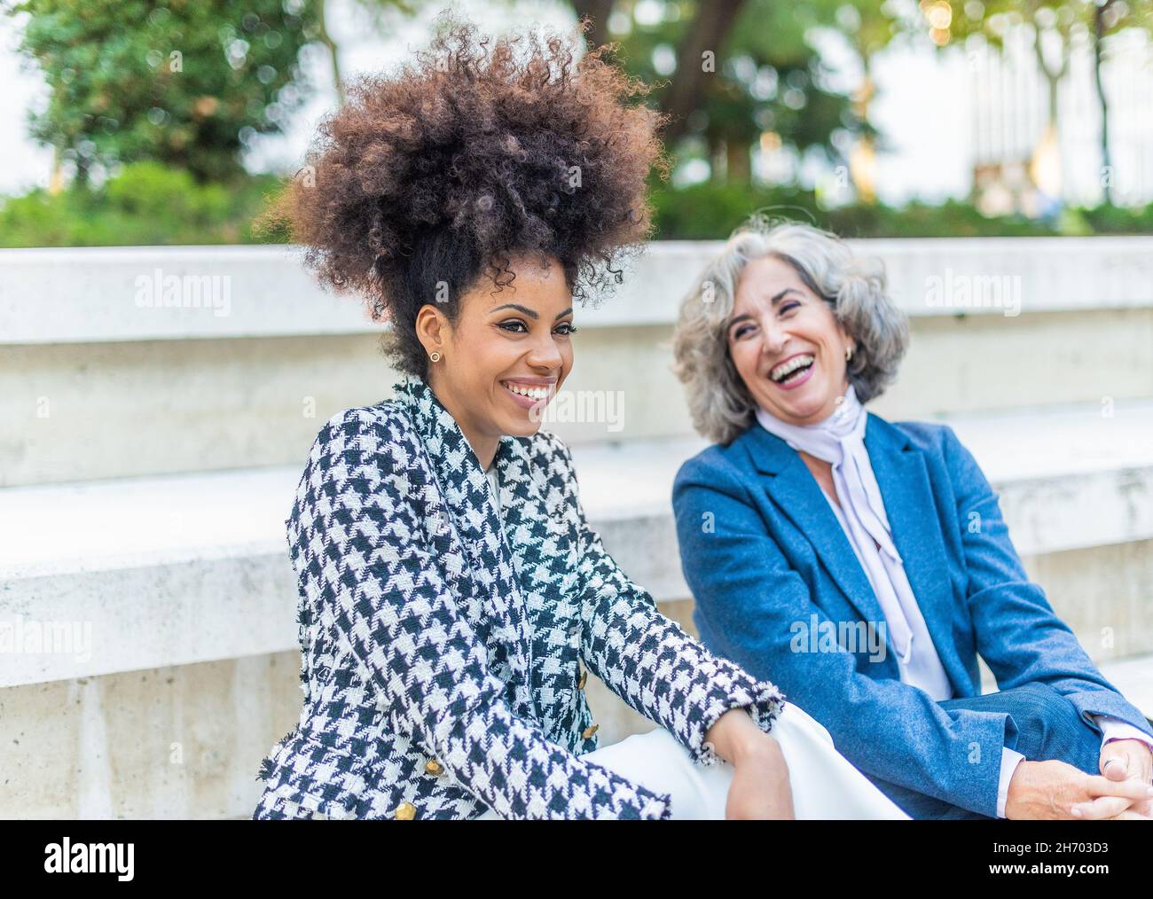 black woman laughing next to laughing mature woman Stock Photo - Alamy