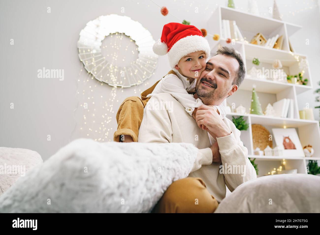 Young dad and his son celebrate christmas together Stock Photo - Alamy