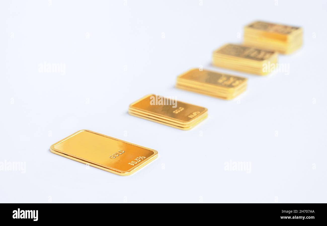 Ladder made of gold bars. Gold ingot on a light background Stock Photo ...
