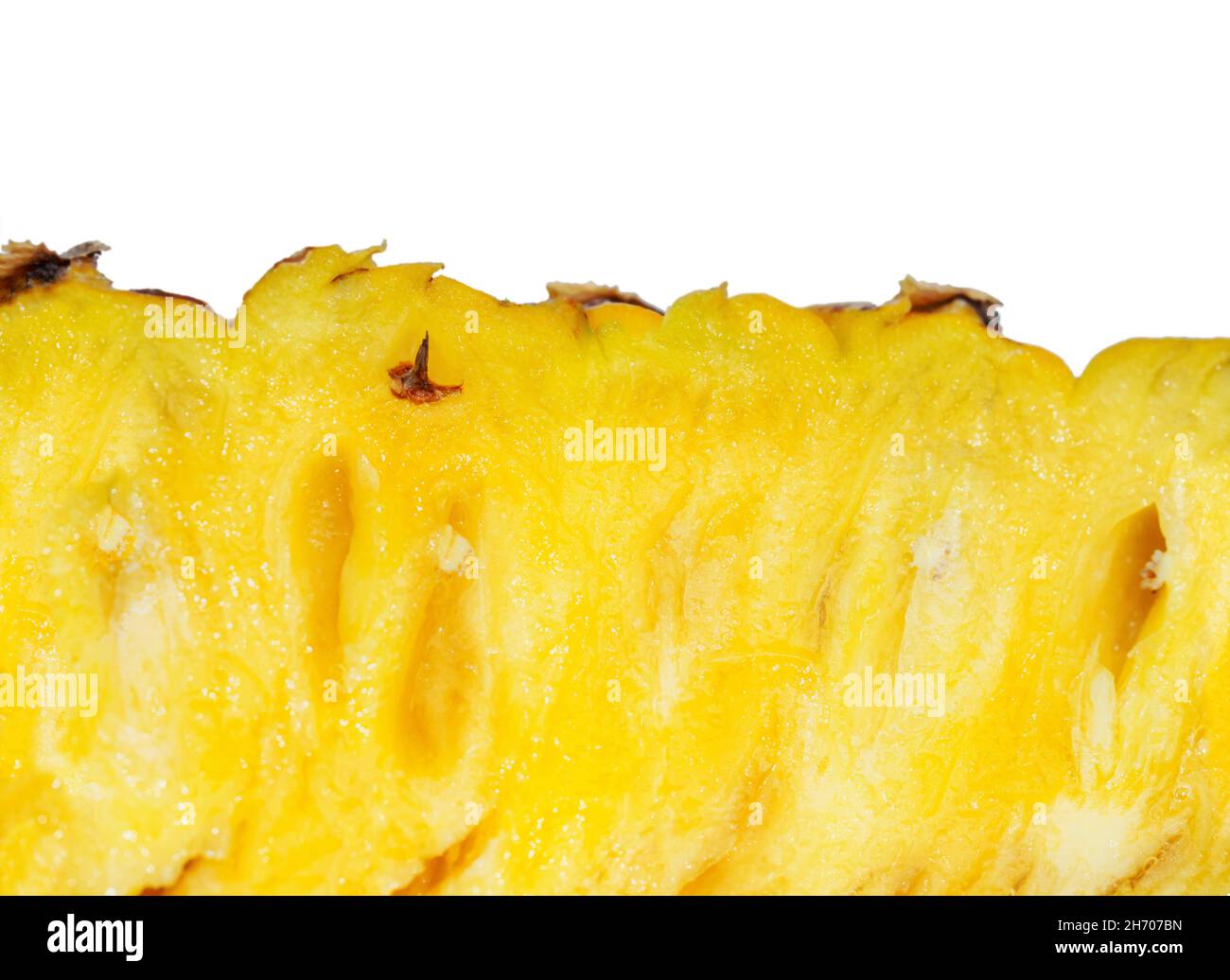 Pineapple slice close-up isolated on white background Stock Photo - Alamy