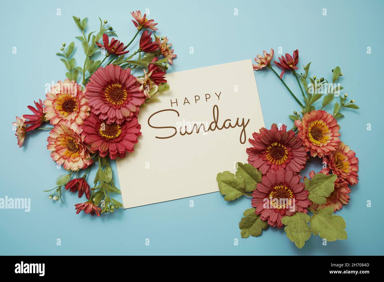 Happy Sunday card typography text with flower bouquet on blue ...