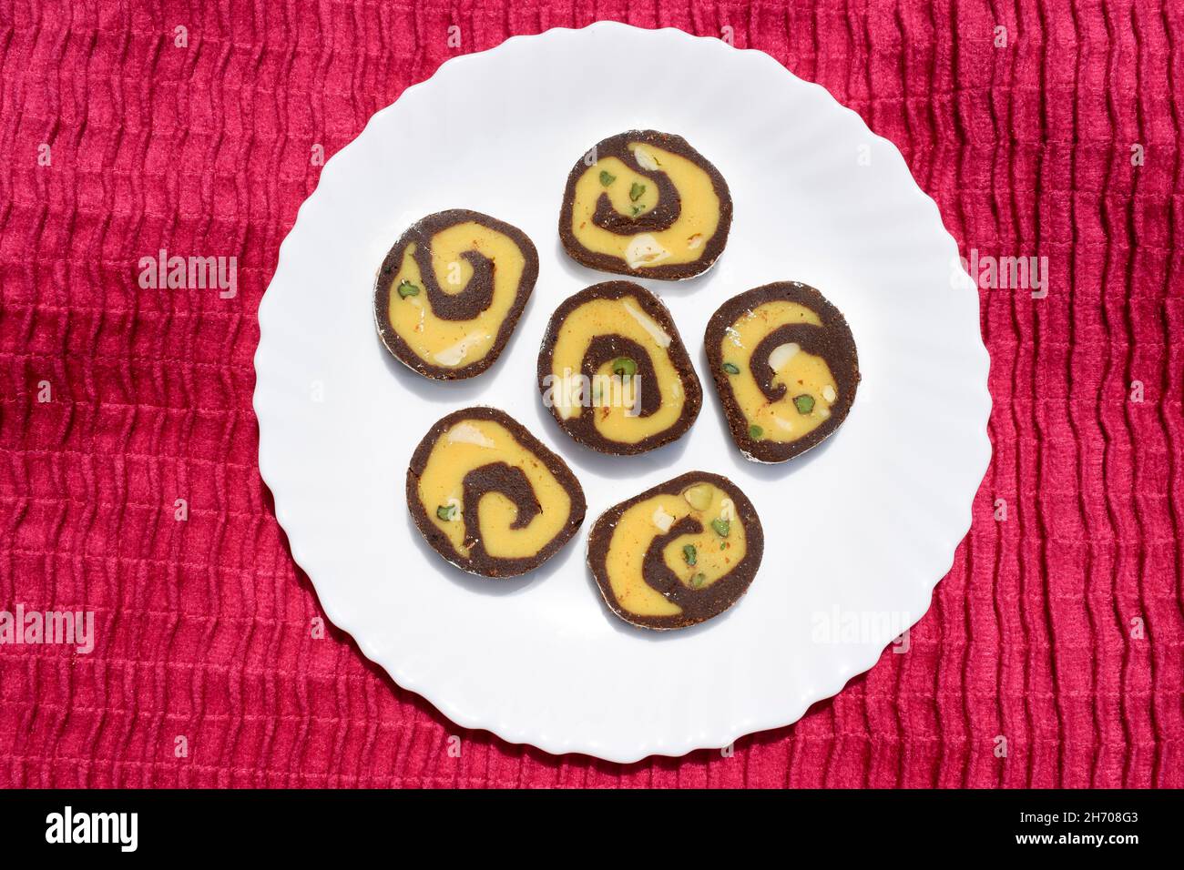 Indian sweet dish called Chocolate barfi roll. Burfi is milk based ...