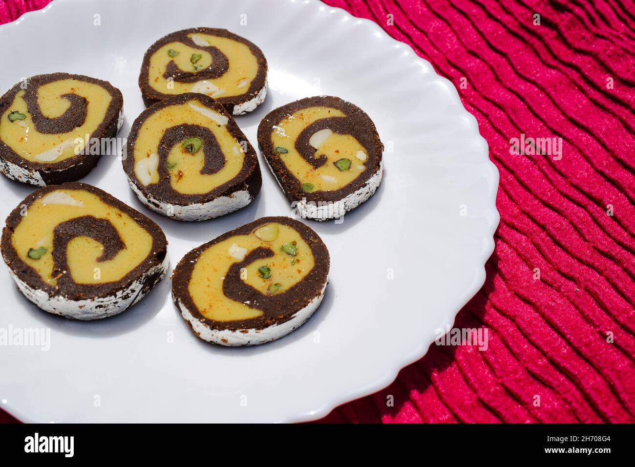 Indian sweet dish called Chocolate barfi roll. Burfi is milk based ...