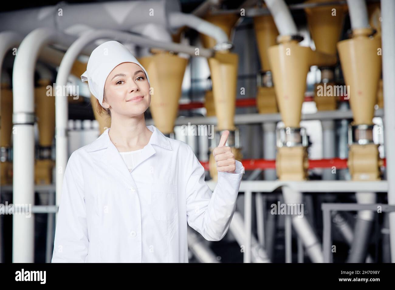 Operator worker woman on background electrical mill machinery for ...