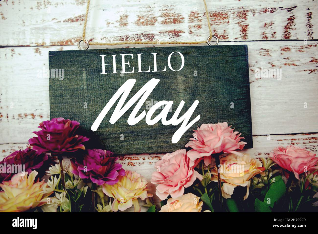 Hello May typography text decorate with flower on wooden background ...