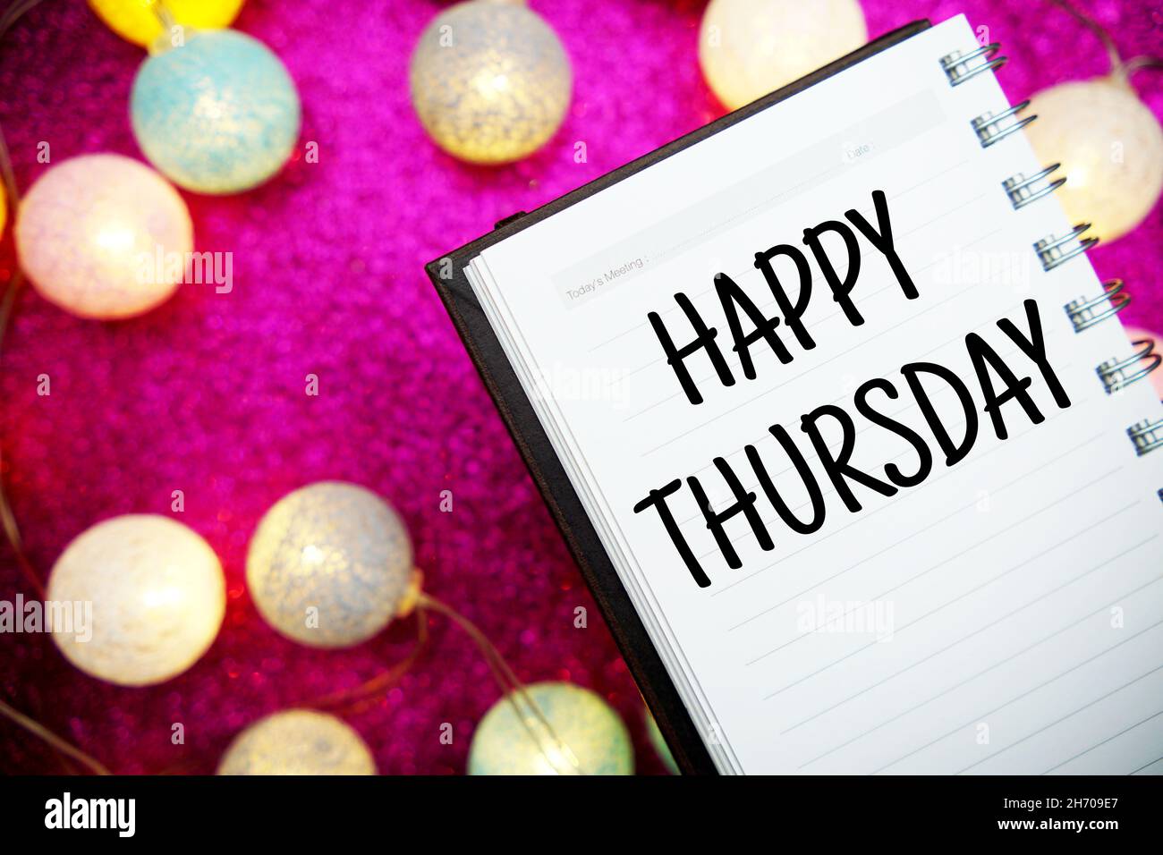 Happy Thursday text notepad mockup and LED cotton balls decoration on ...