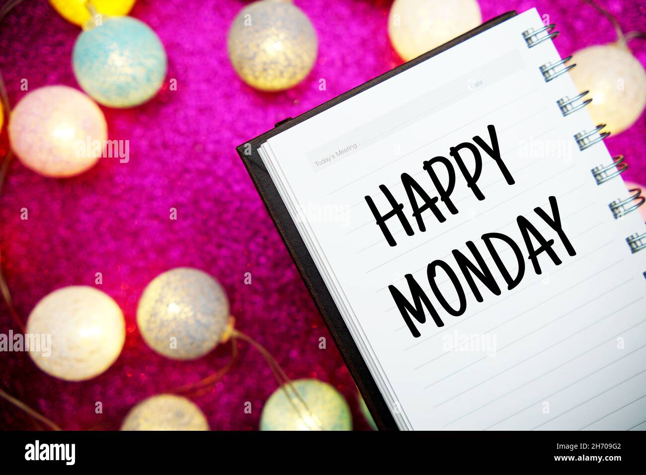 Happy Monday text on notepad mockup and LED cotton balls decoration on ...