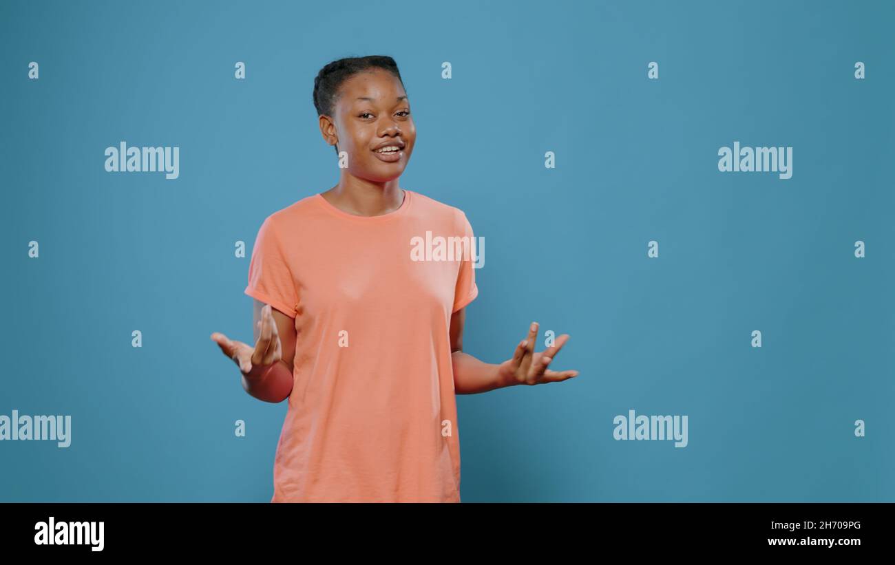 African american woman singing song and gesticulating with hands in ...