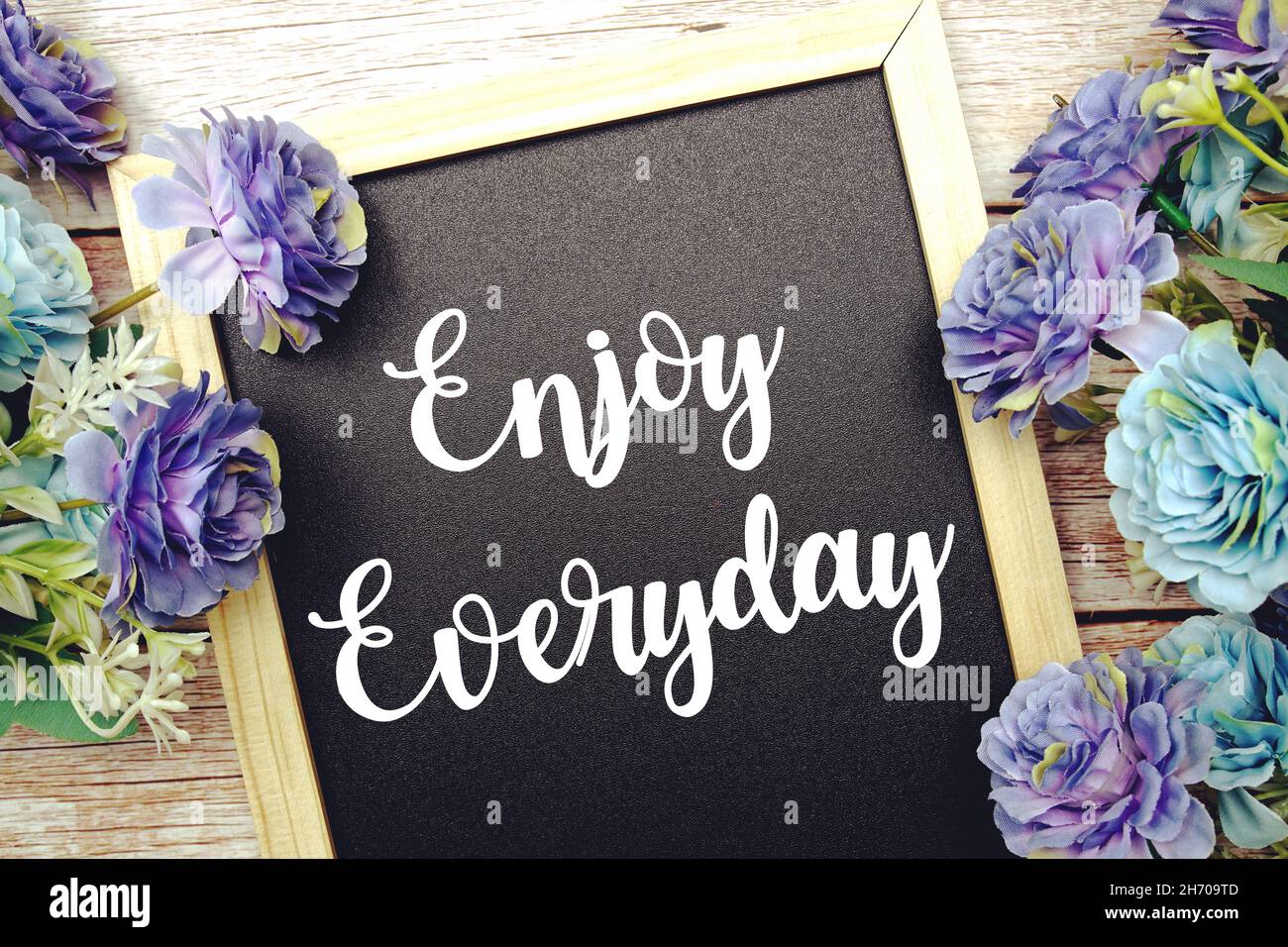 Enjoy everyday quotes on blackground decorated with flower bouquet on ...