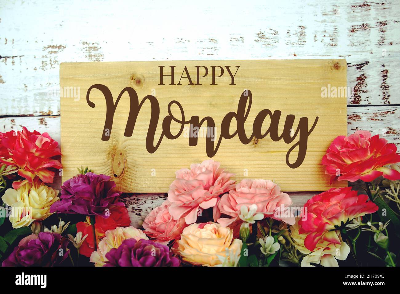 Happy Monday text on wooden planks decoration with flower border frame ...