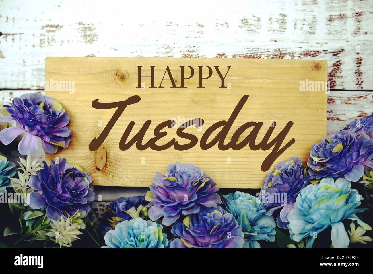 Happy Tuesday text on wooden planks decoration with flower border frame ...