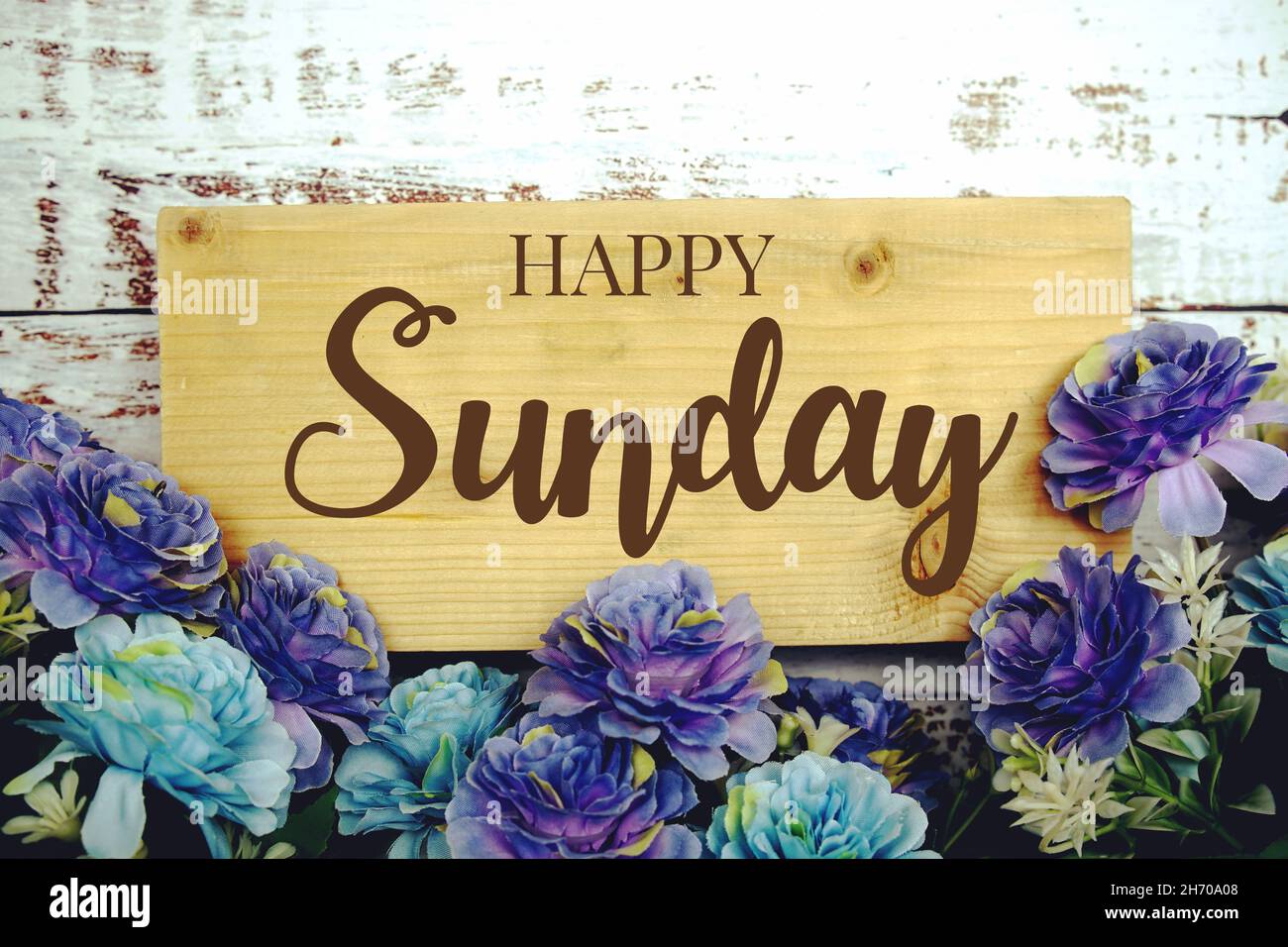 Happy Sunday text on wooden planks decoration with flower border frame ...