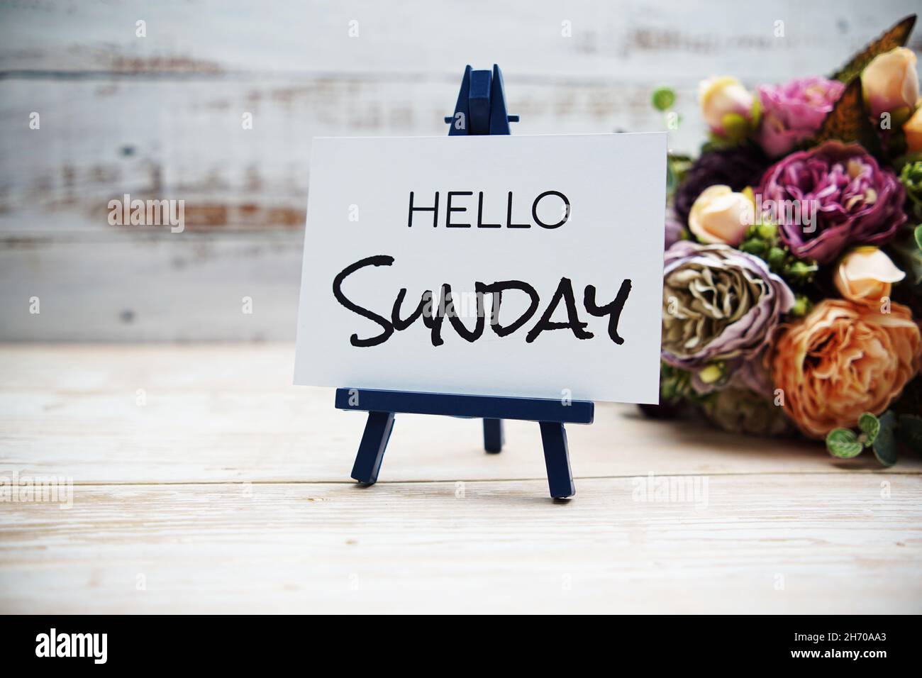 Hello Sunday text with flower bouquet on wooden background Stock Photo ...