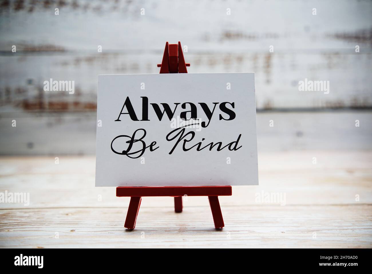 Always Be Kind text on paper card with wooden background Stock Photo ...